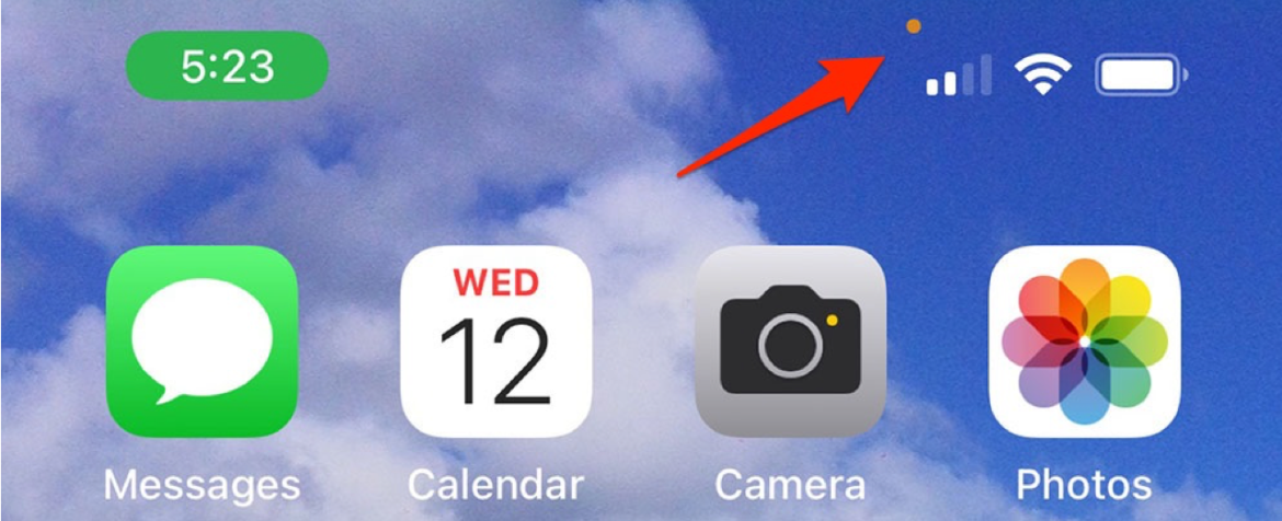 You should know what the orange and green dots at the top of your phone ...